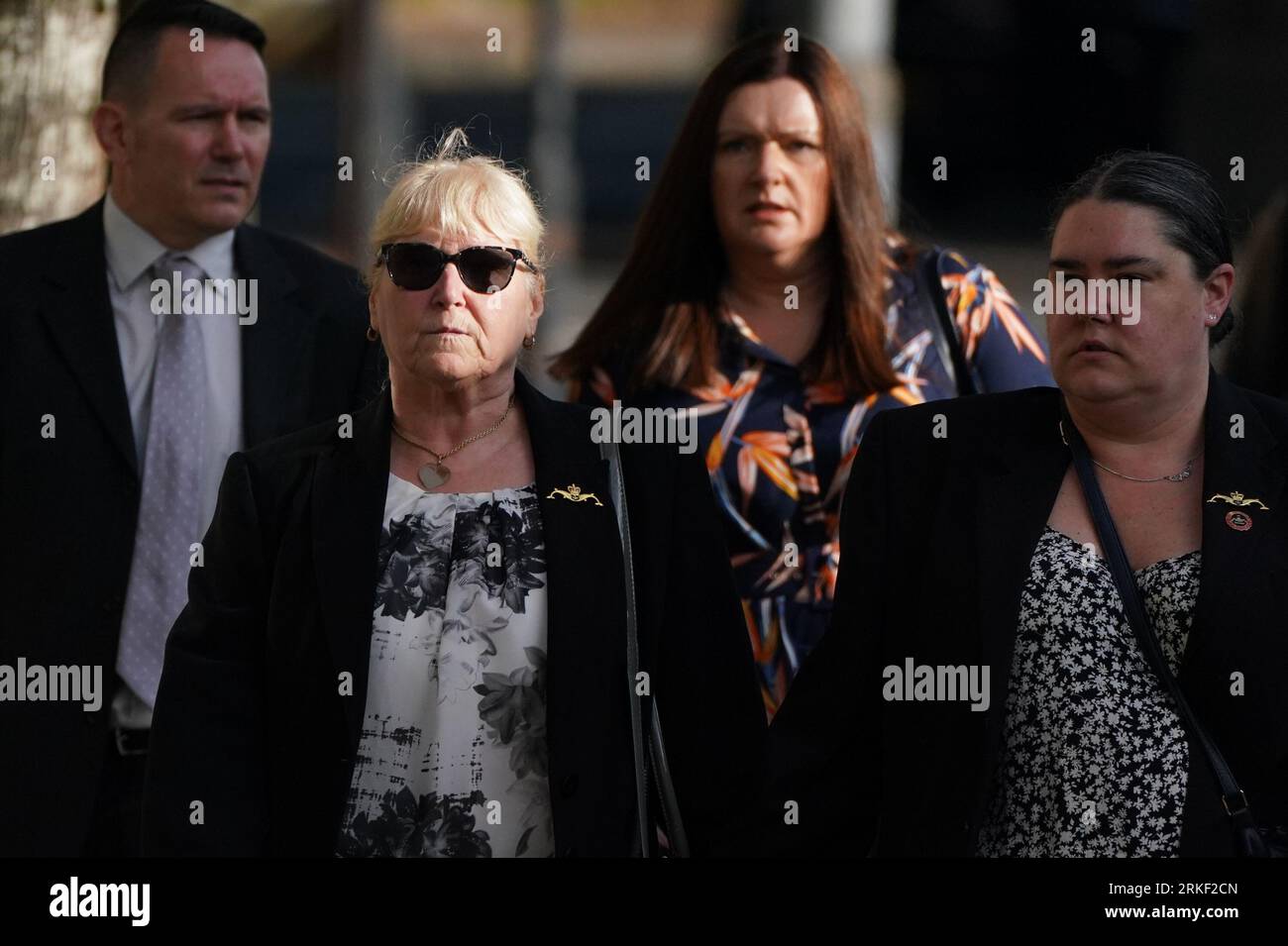The widow of Tony Parsons, Margaret Parsons (second left) arrives at ...