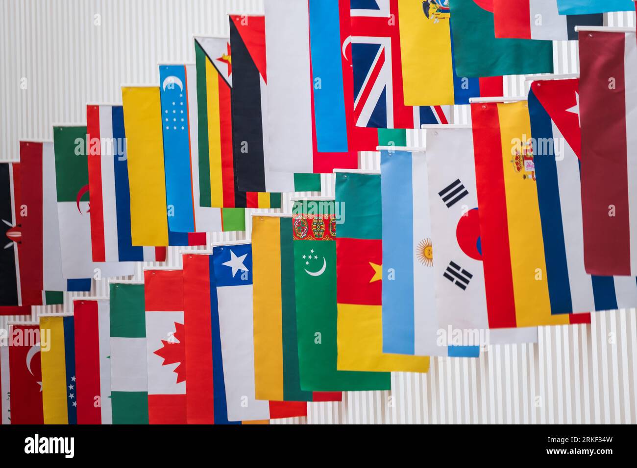 Colorful national flags of various countries hanging in row on street ...