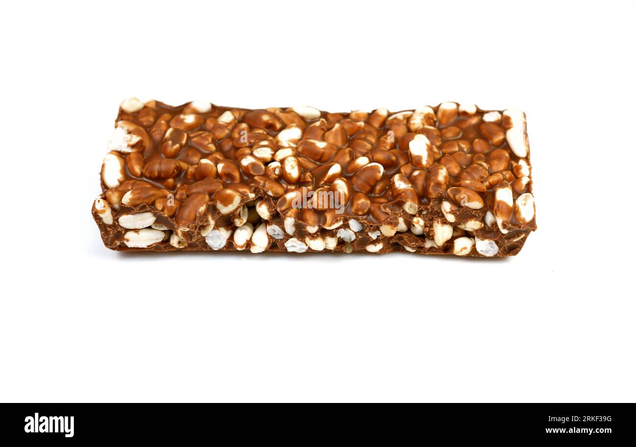 Chunks of milk chocolate with puffed rice isolated on white background ...