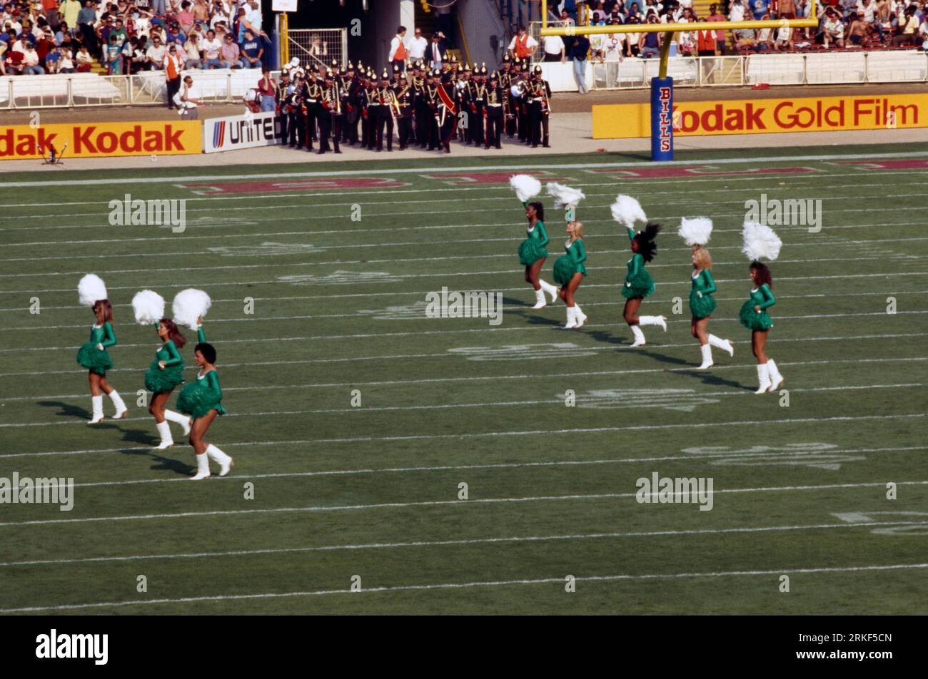 Cheerleaders at American Football Game Dancing to Marching Band Music ...