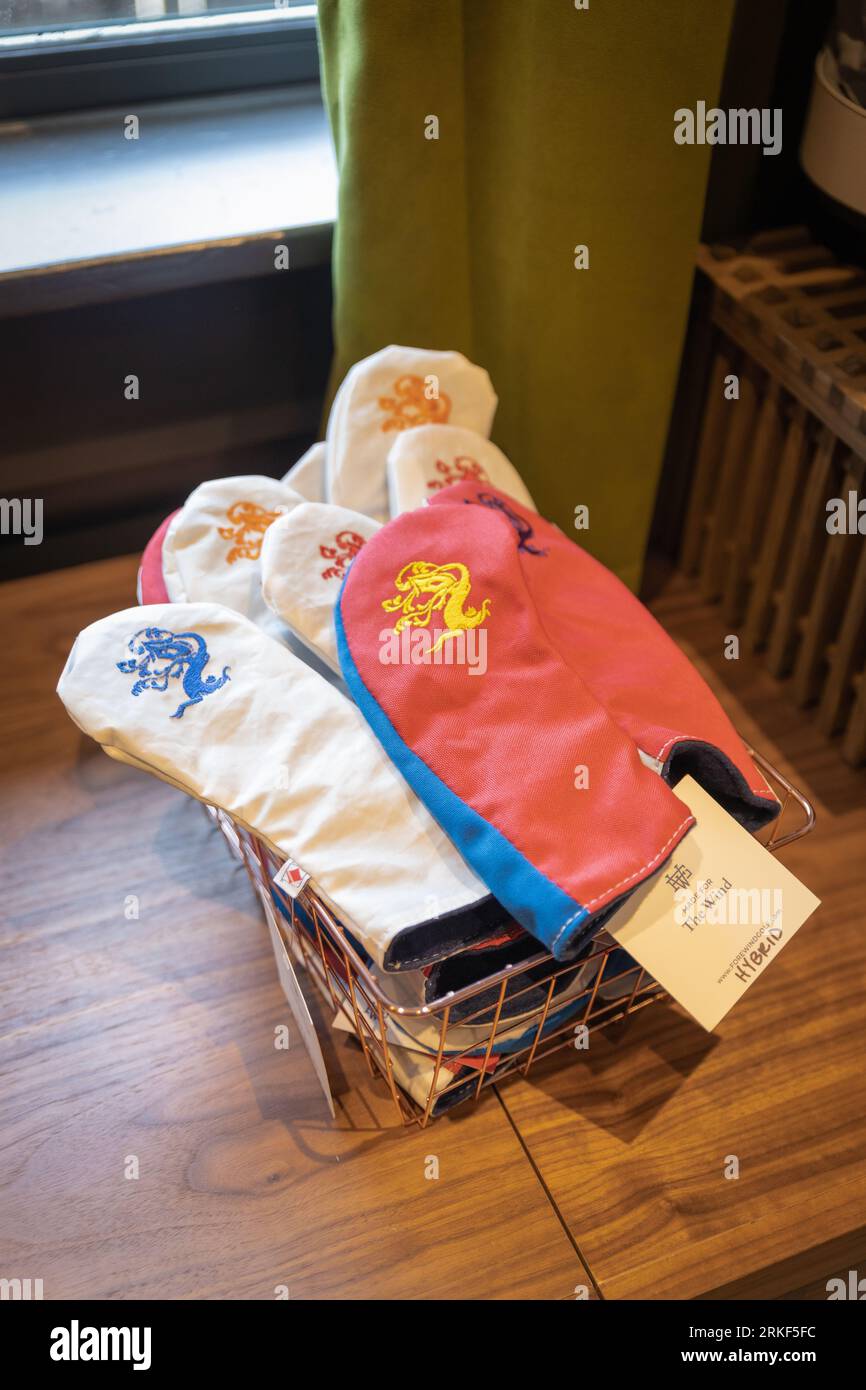 golf club covers in assorted colors and designs on display in a pro ...