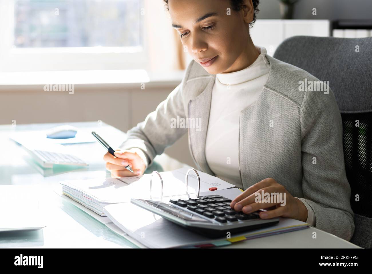African American Tax Professional Female With E Invoice Stock Photo - Alamy