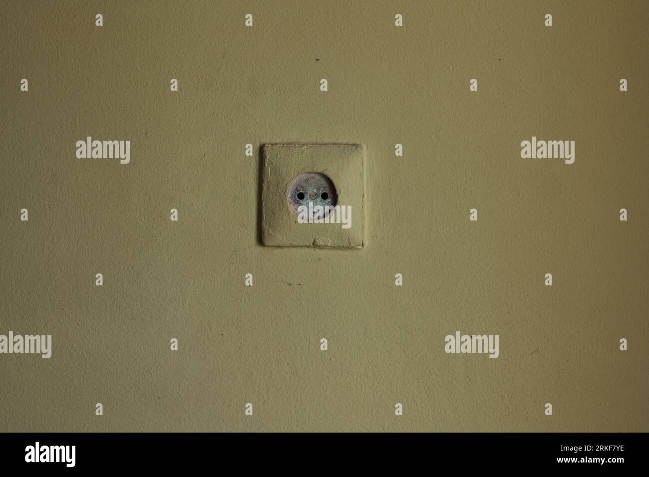 An electrical wall socket in a residential building in a low-income ...