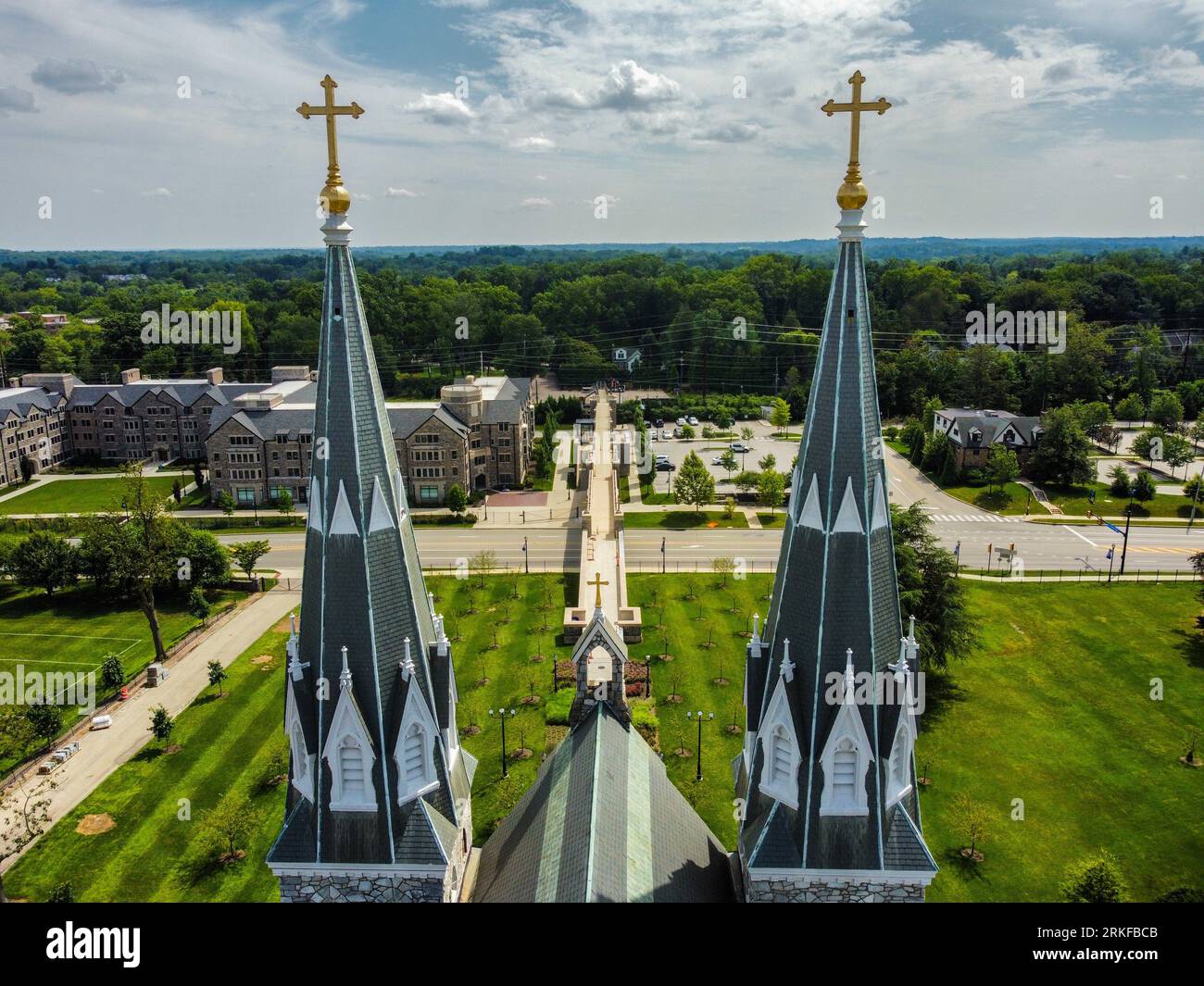 An aerial view of a church in a green town on a sunny day Stock Photo ...