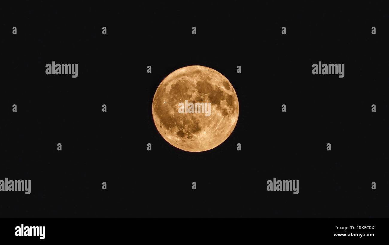 A luminous full moon in the night sky Stock Photo - Alamy