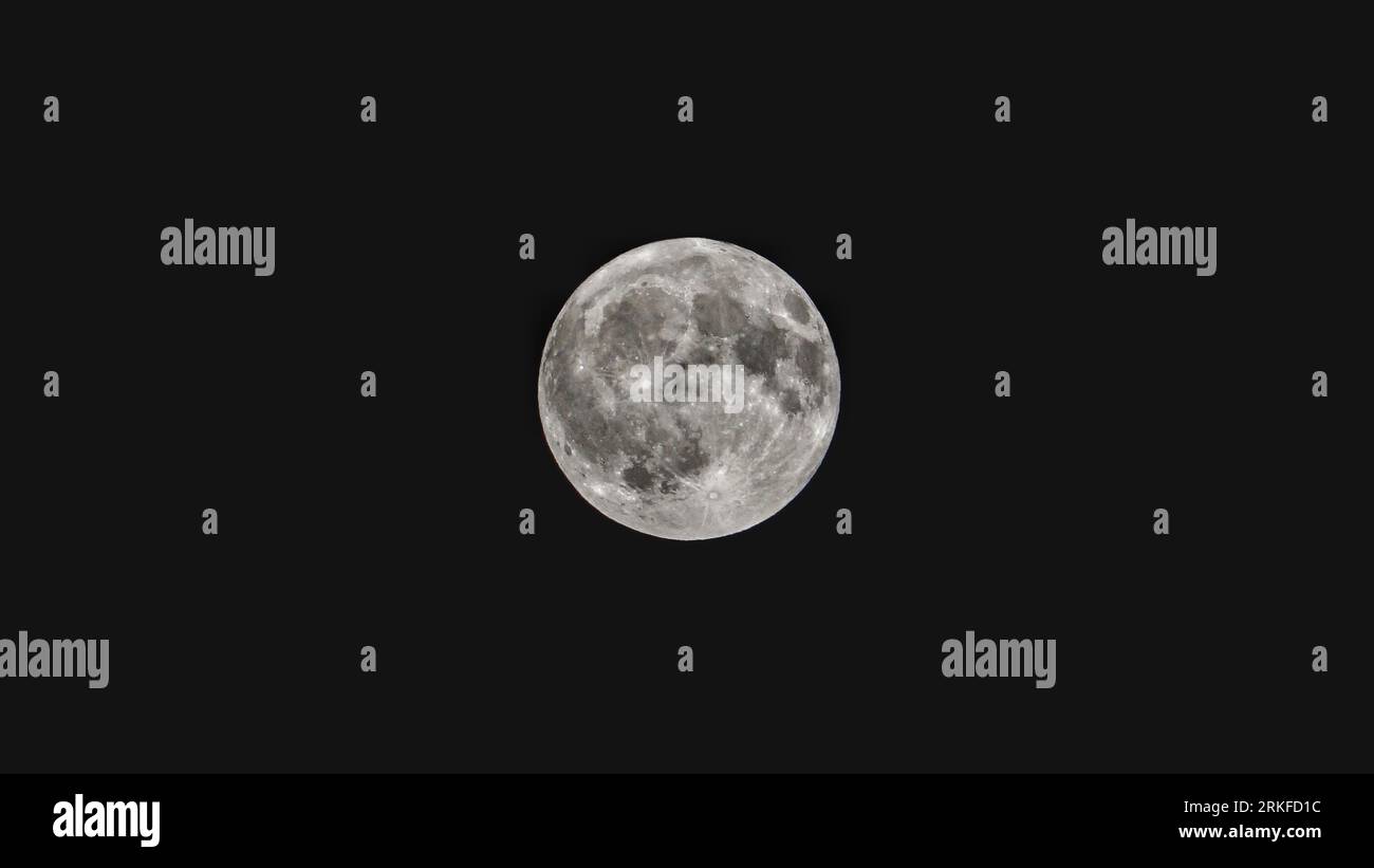 A luminous full moon in the night sky Stock Photo - Alamy