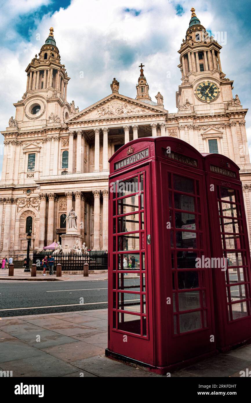 A scenic view of St. Paul's Cathedral with a phone booth and clock ...