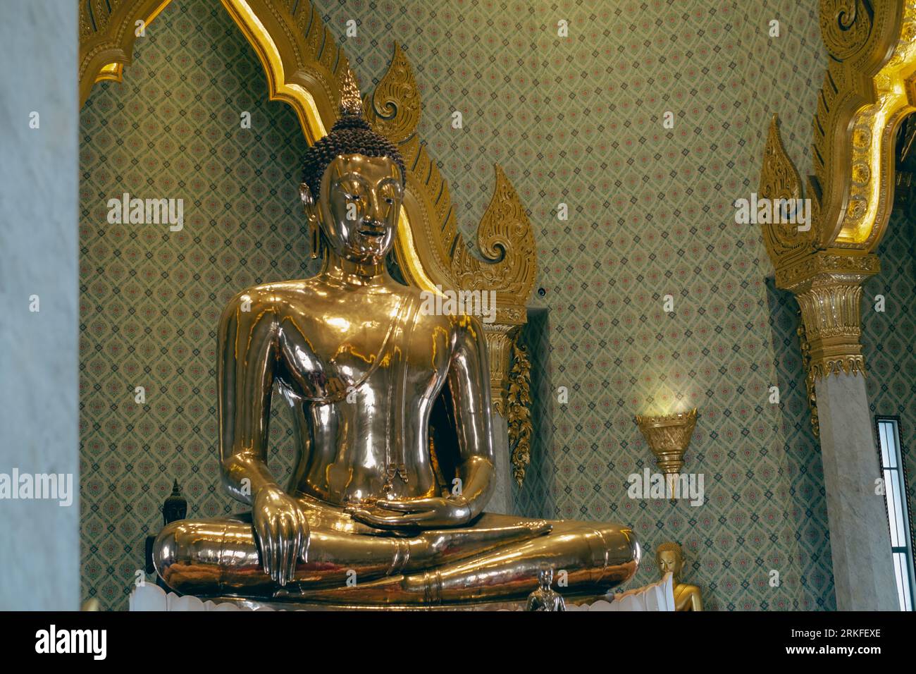 Gold Buddha statue inside a temple Stock Photo - Alamy