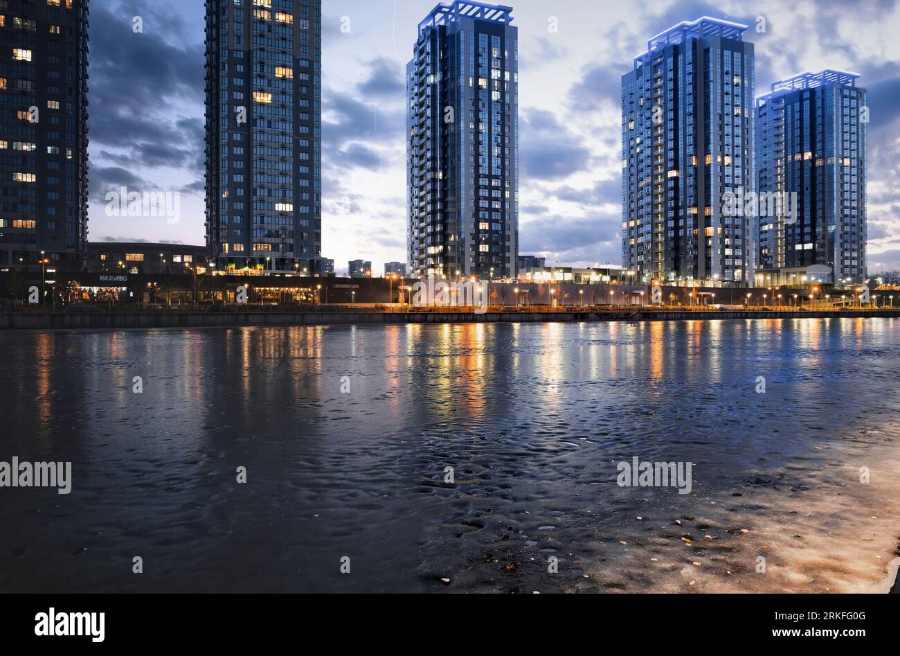 Downtown night scene, beautiful modern buildings, bright glowing lights ...