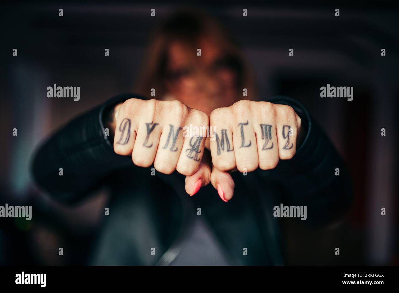 Tattoo text on fingers Stock Photo - Alamy