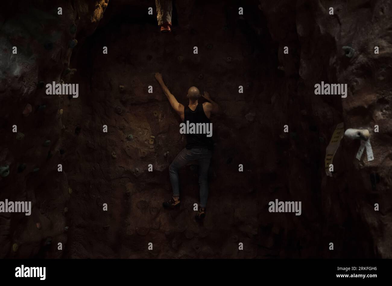 strong Male bouldering, climbing indoors Stock Photo - Alamy