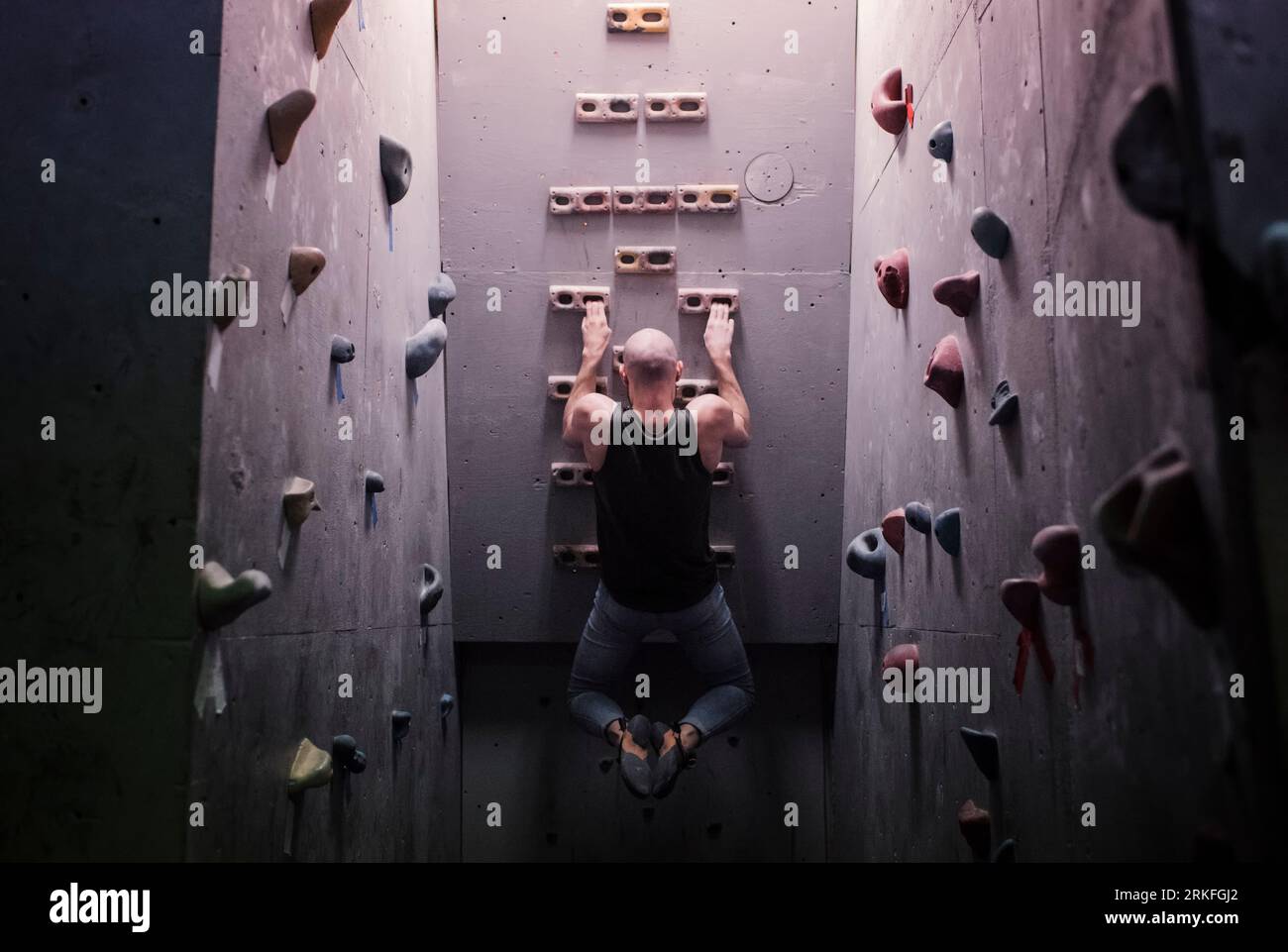 strong man exercising on a climbing wall doing pull ups Stock Photo - Alamy