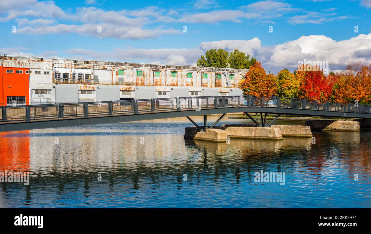Bridge and warehouse, with bright maple trees, in Montreal, Canada ...
