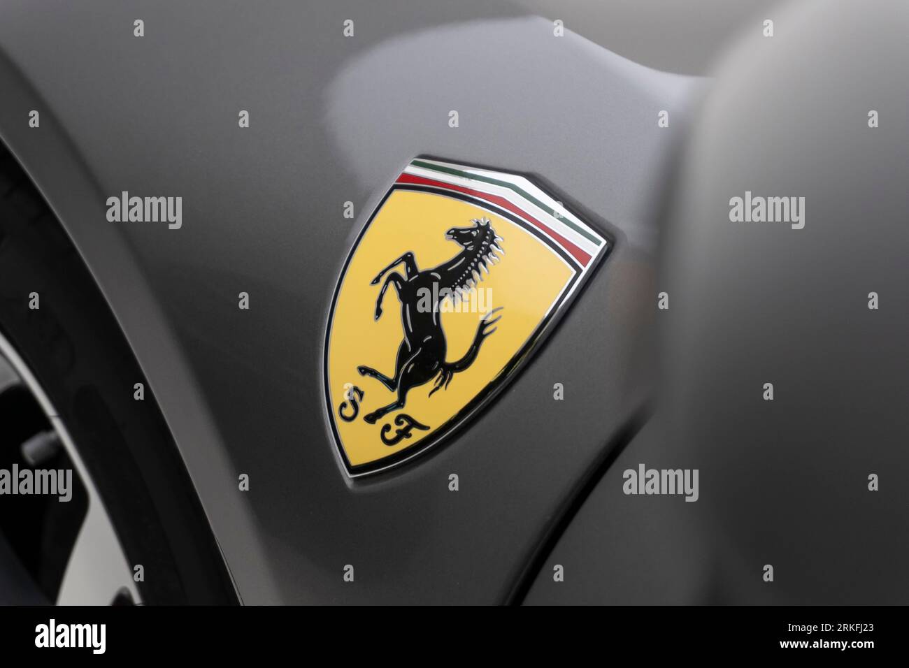 Scuderia Ferrari badge on side fender of a grey SF90 Stock Photo - Alamy