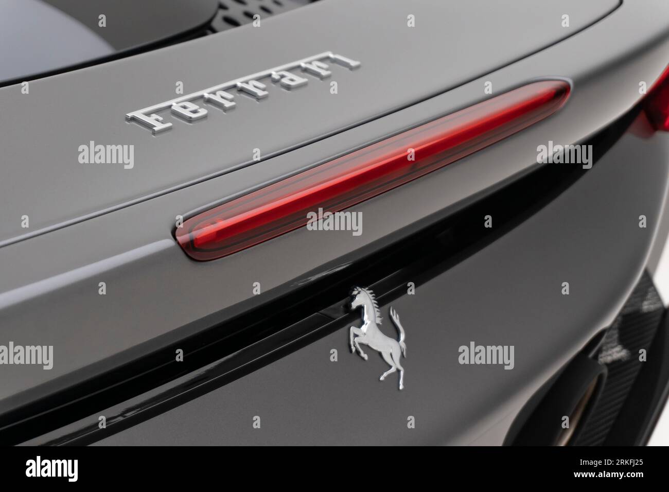 Rear badges of a grey Ferrari Sf90 under studio light Stock Photo - Alamy