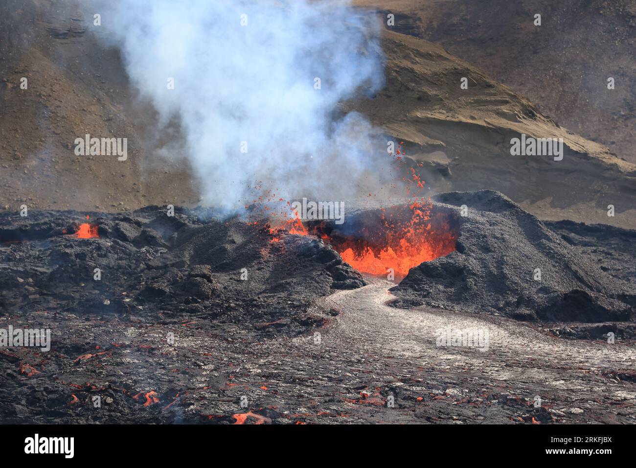 A volcanic eruption revealing the lava and ash that billowing into the ...