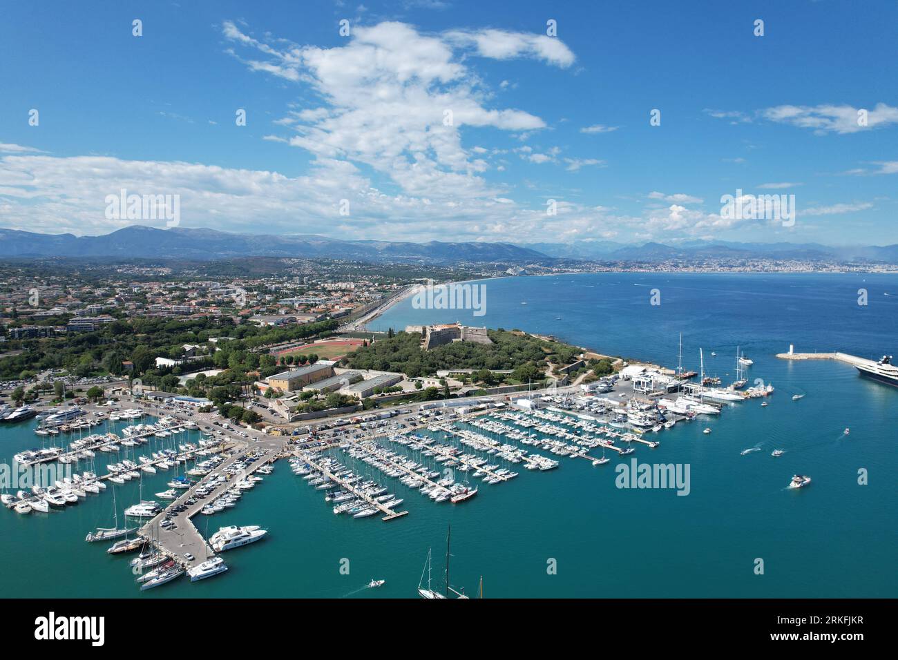 An aerial view of a brilliant sunny day in a tranquil harbor in ...