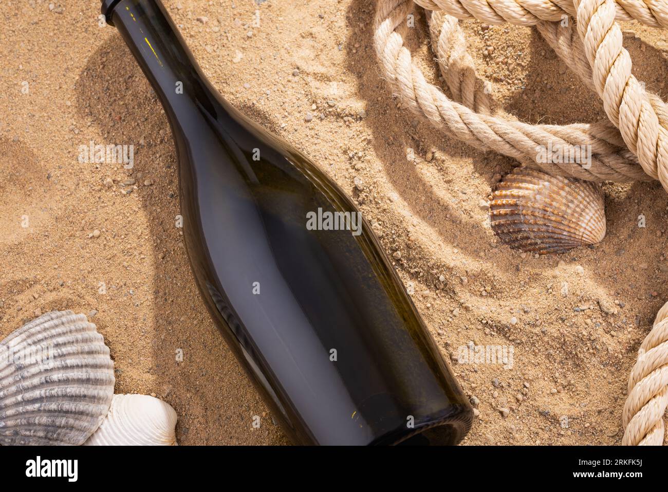 Empty bottle alcohol on beach hi-res stock photography and images - Alamy