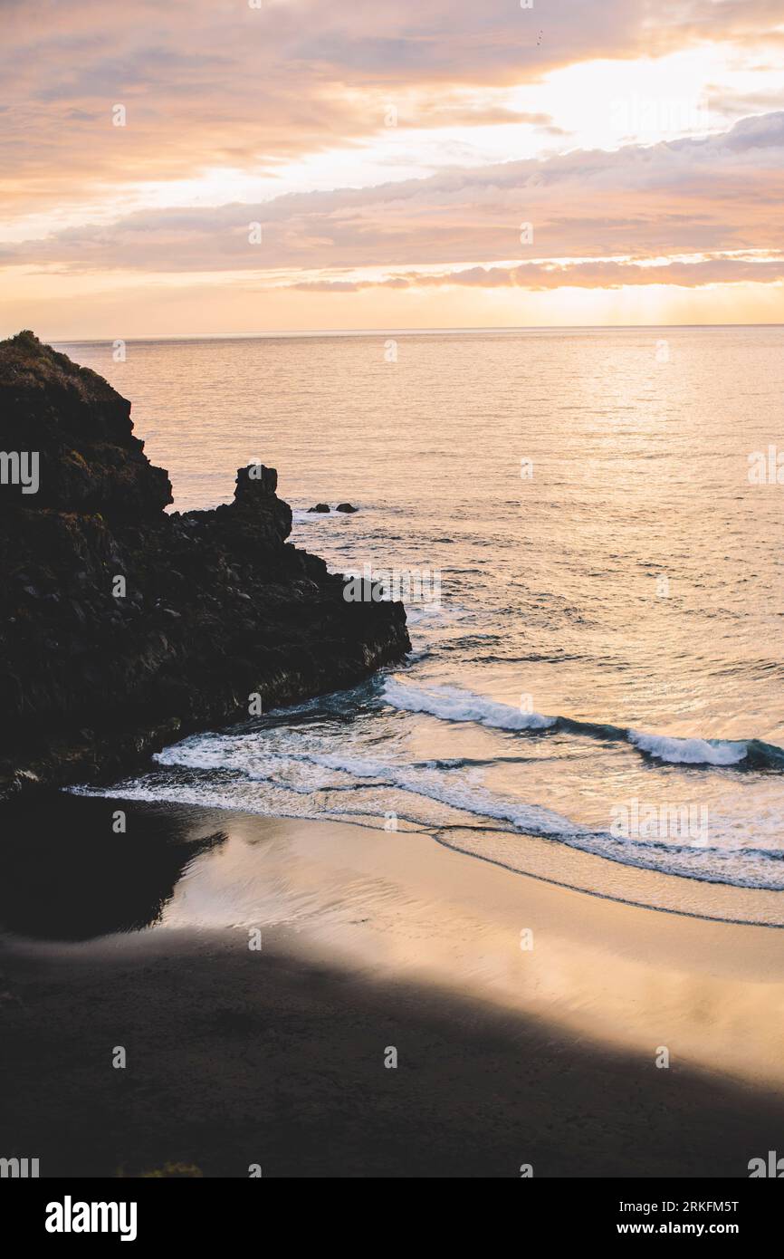 Sunset on ocean wild beach hi-res stock photography and images - Alamy