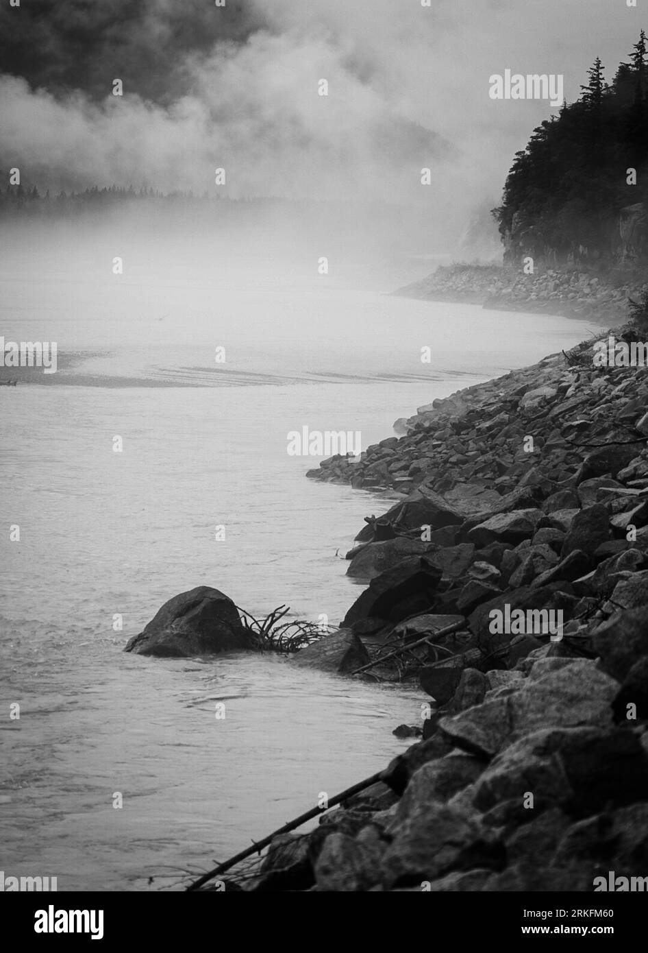 Black & White photo of fog rising over a river Stock Photo - Alamy