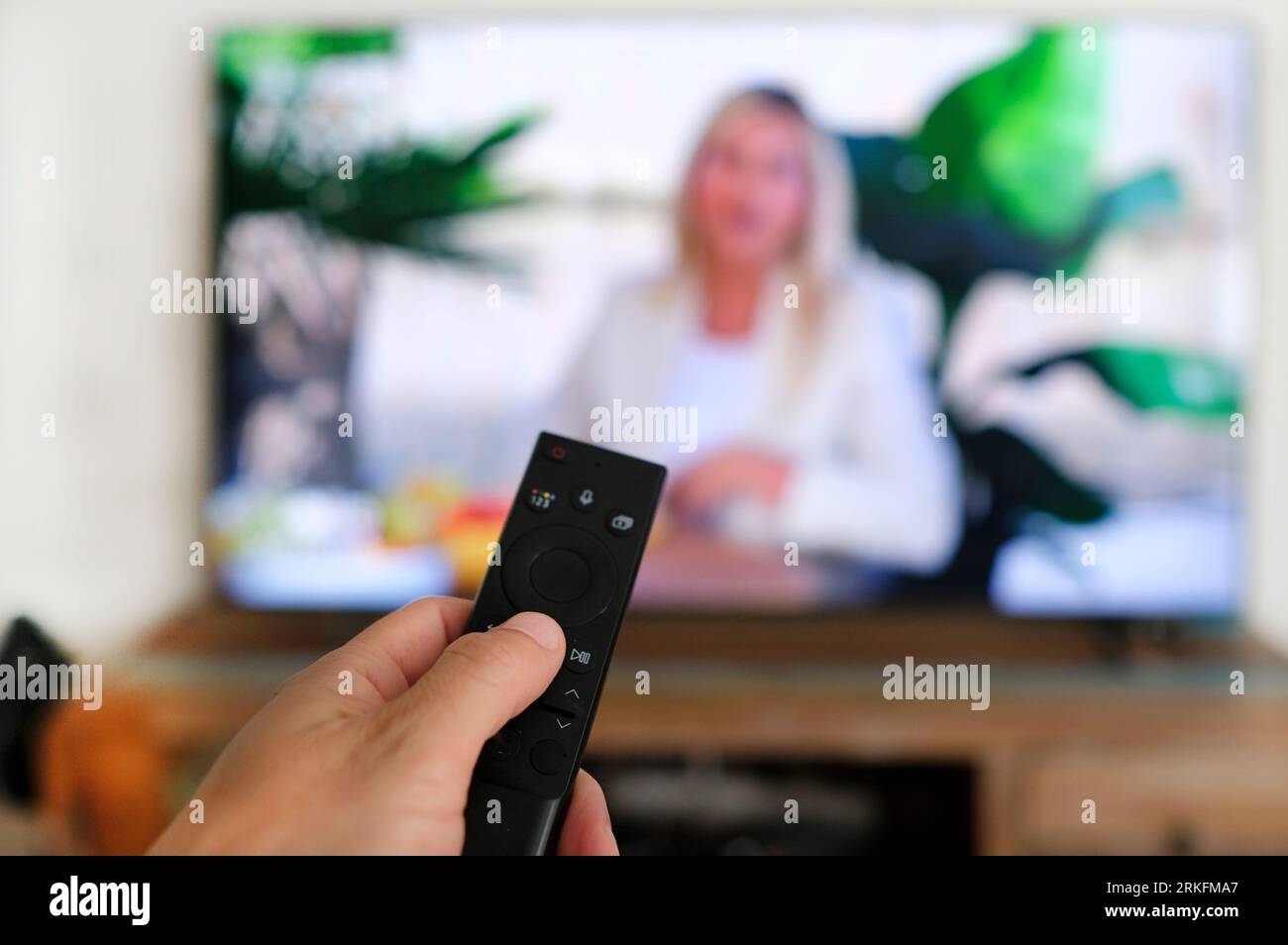 Remote control and screen - watching the favorite TV show Stock Photo ...