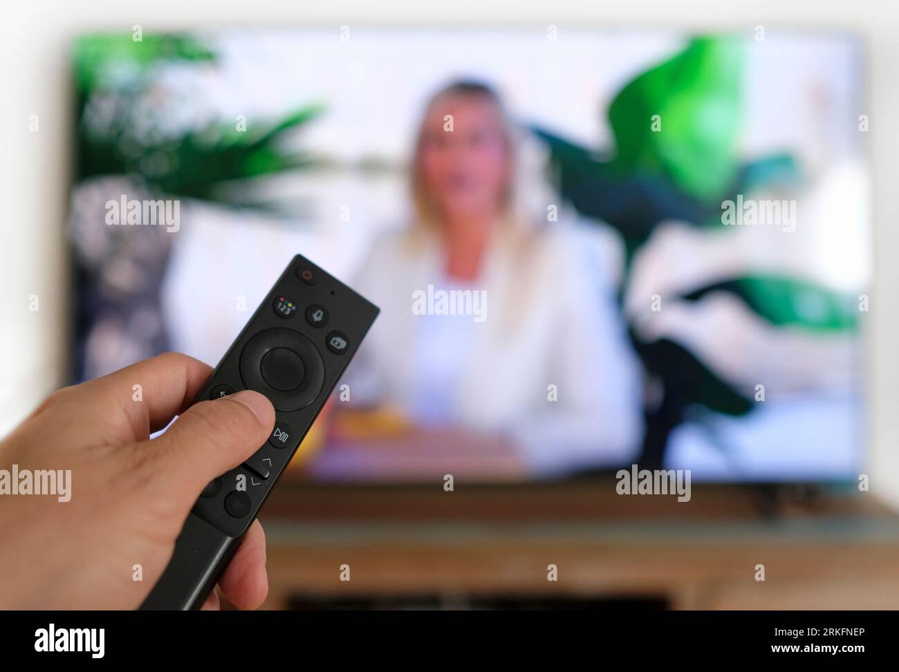 Remote control and screen - watching the favorite TV show Stock Photo ...