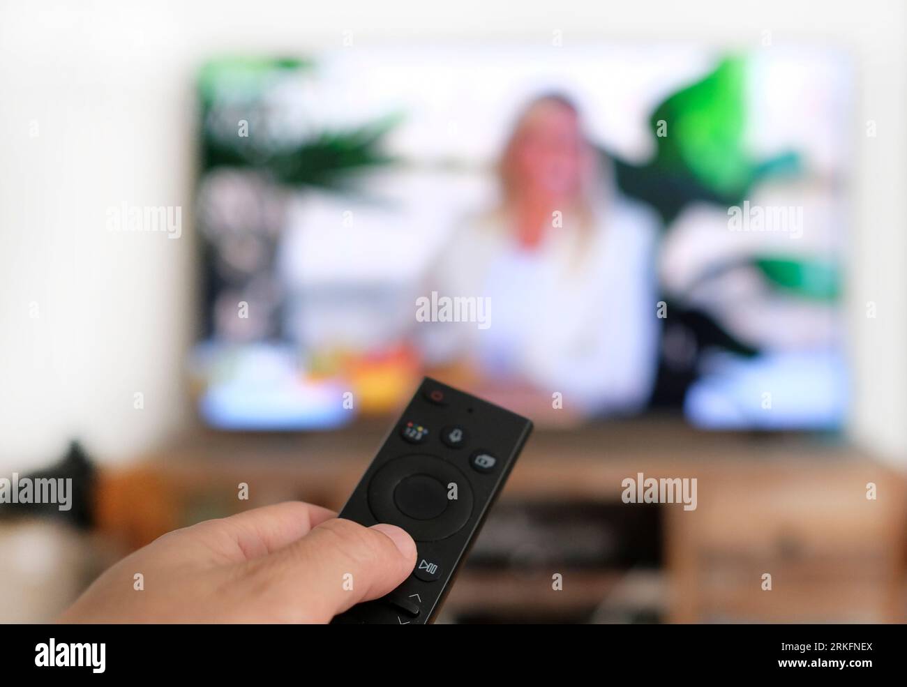 Remote control and screen - watching the favorite TV show Stock Photo ...