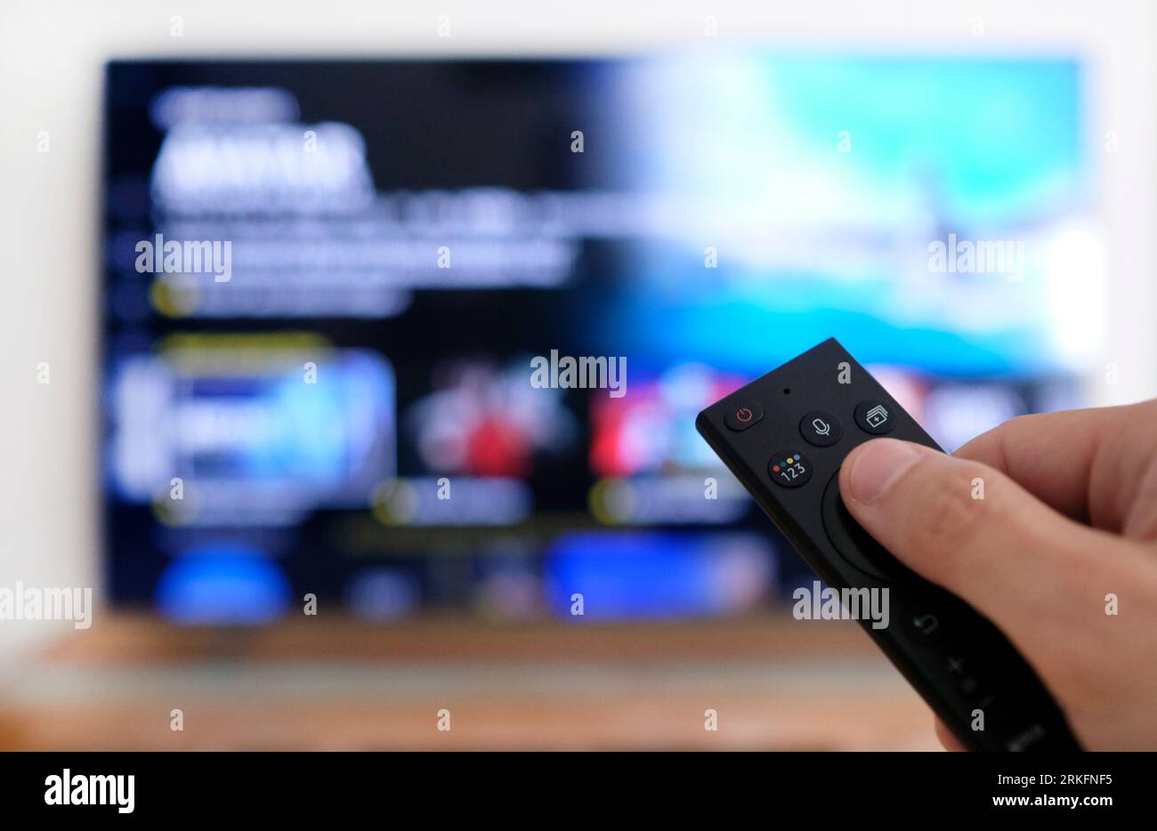 Remote control and screen - watching the favorite TV show Stock Photo ...
