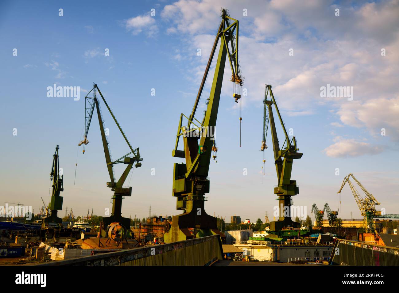 A vibrant scene of industrial cranes at a dock Stock Photo - Alamy