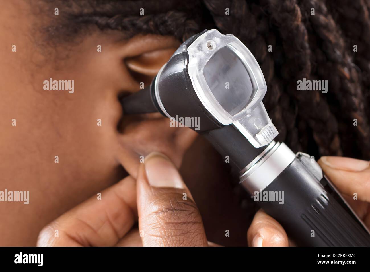 Doctor Using Otoscope Instrument To Check Girl's Ear In Hospital Stock ...