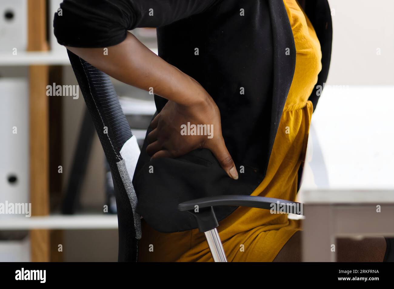 Back Pain Bad Posture Woman Sitting In Office Stock Photo - Alamy