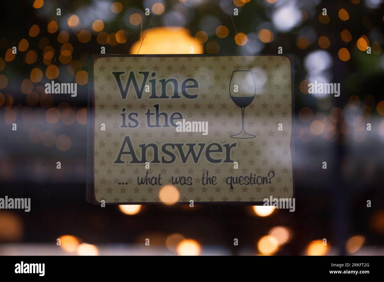 Sign in the window of a bar saying "Wine is the answer… What was the ...