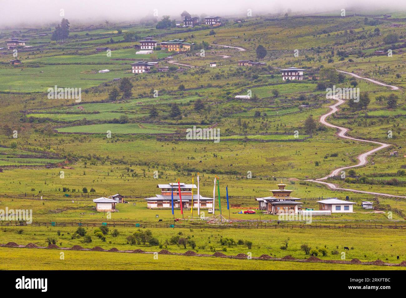 An idyllic landscape of Bhutan's countryside featuring a vibrant green ...