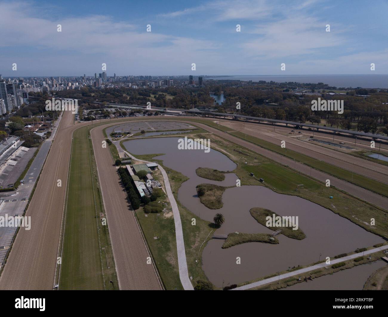 An aerial view of a metropolitan city, featuring a modern highway and ...