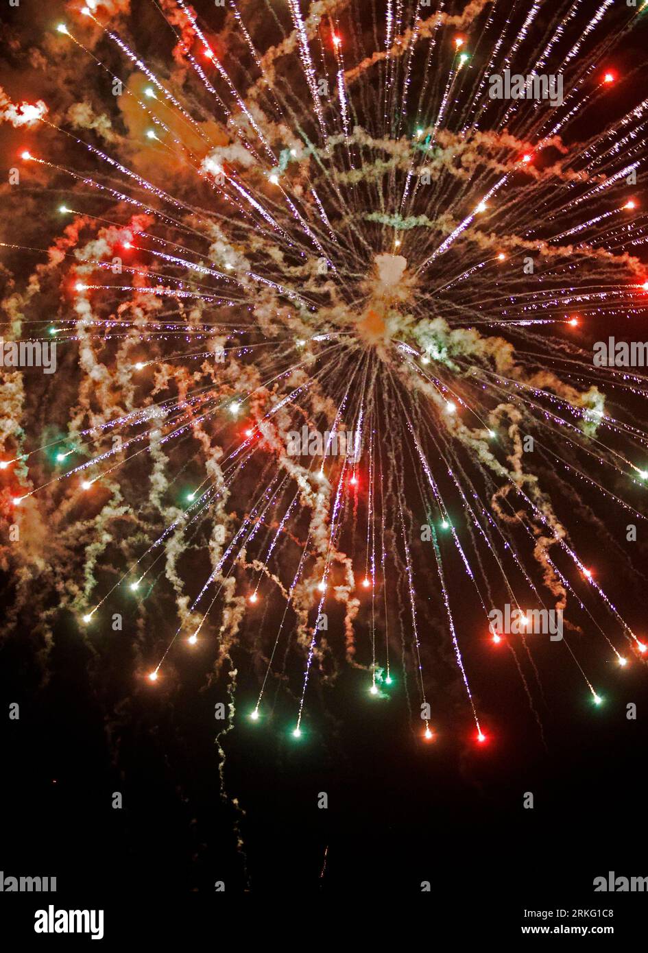 A vibrant and colorful explosion of fireworks, light up the night sky ...