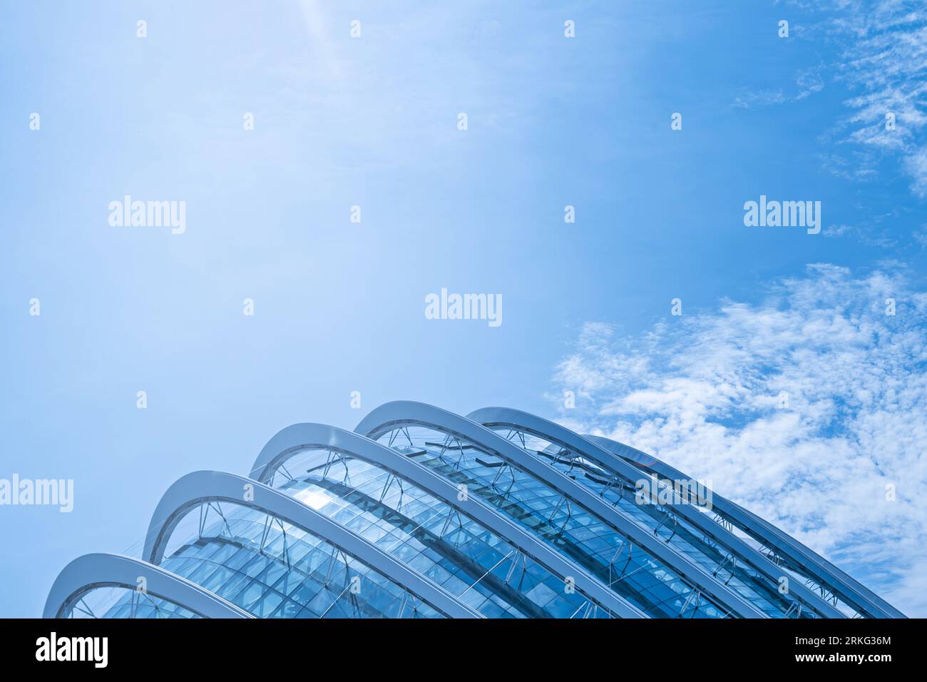 Grey Unusual Curve Geometric Steel Metalic Cladding On A Generic Modern