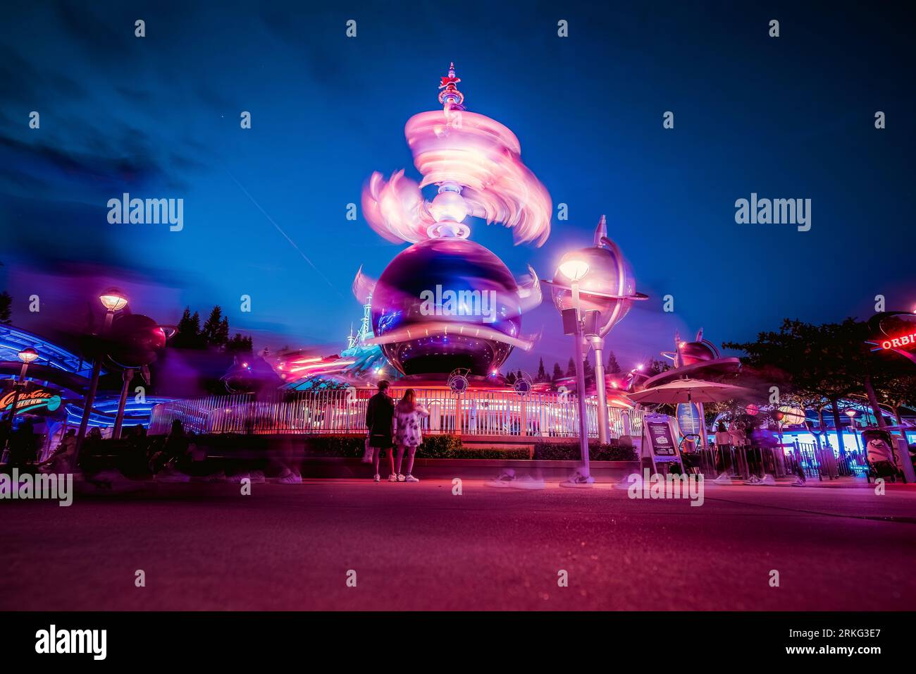A night scene of "Astro Orbiter" floating in the sky in DisneyLand. Low ...
