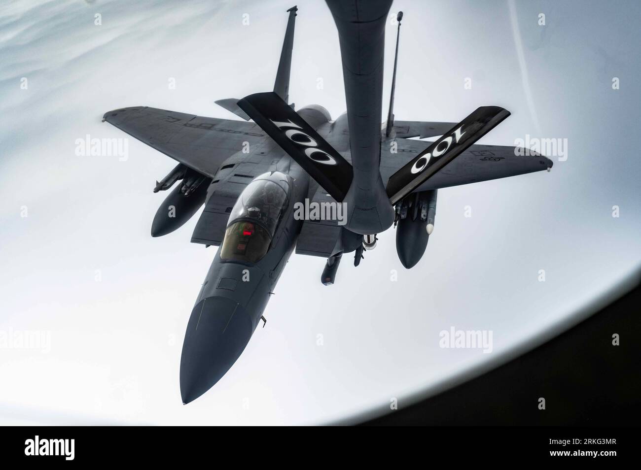 An F-15 Eagle approaches a KC-135 before receiving aerial refueling ...