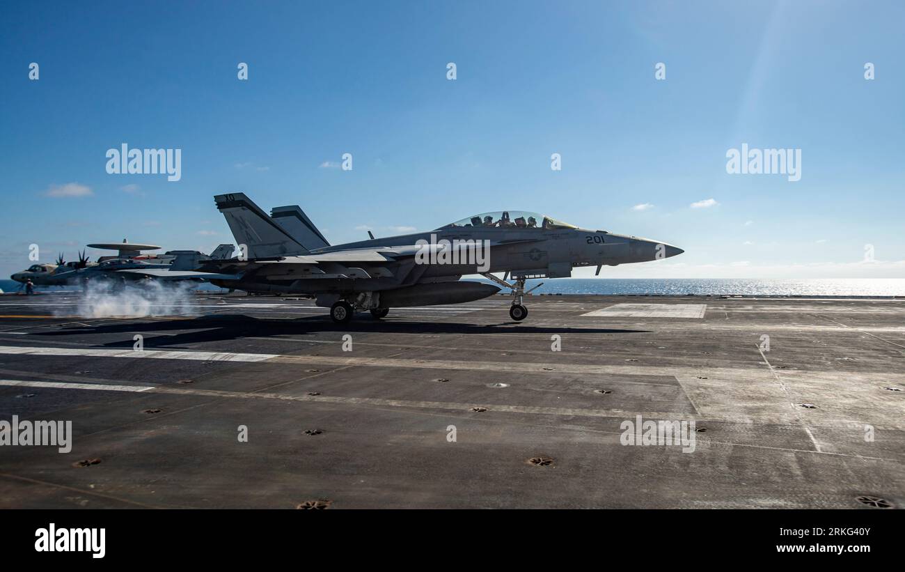 An F/A-18F Super Hornet touches down on the flight deck of the aircraft ...