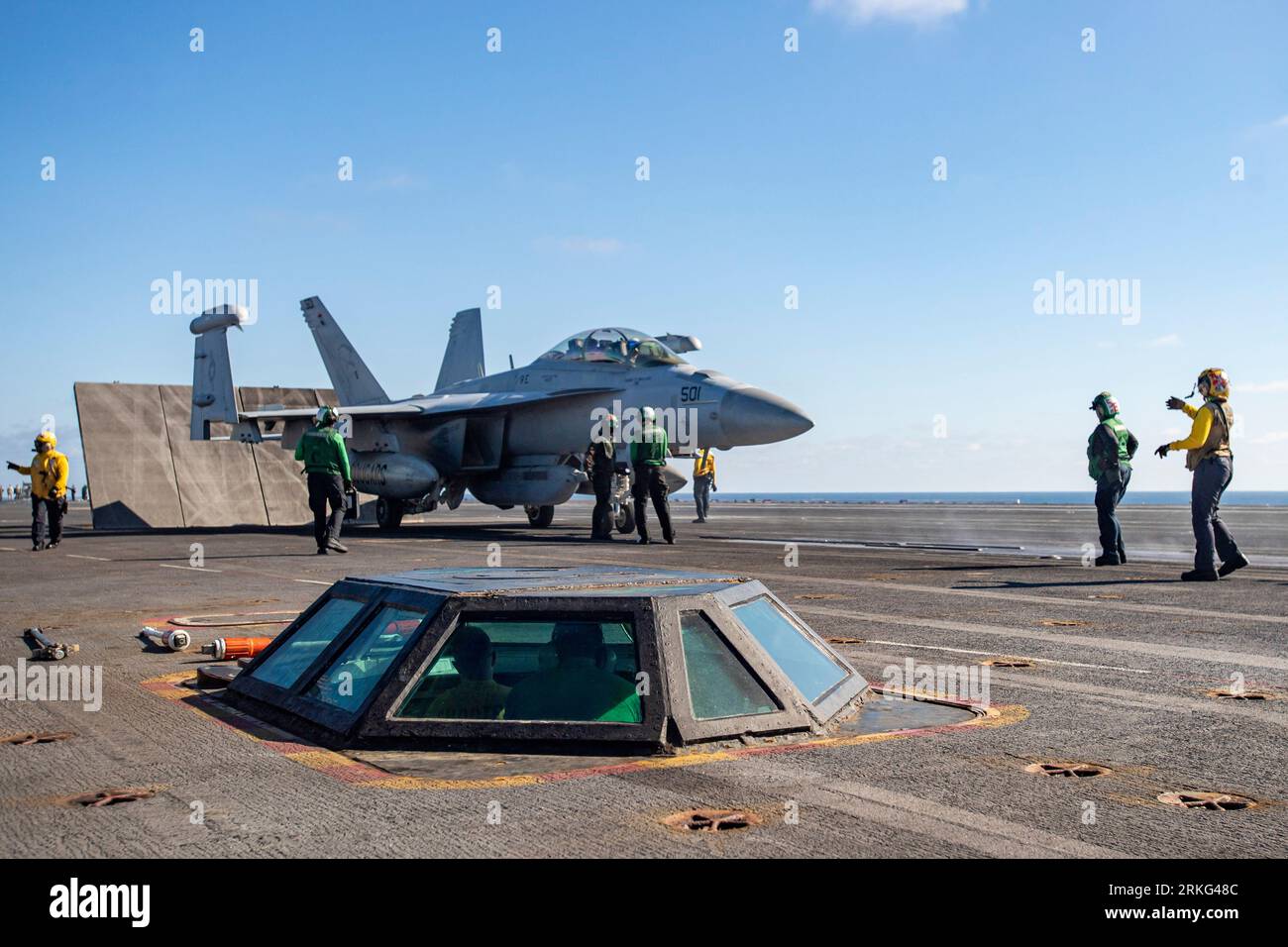 An E/A-18G Growler prepares to launch from the flight deck of the ...