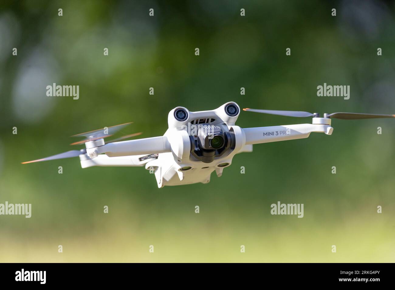A remote-controlled drone hovers in the sky, capturing aerial footage ...