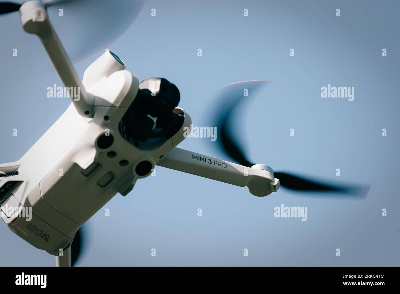 A remote-controlled drone hovers in the sky, capturing aerial footage ...
