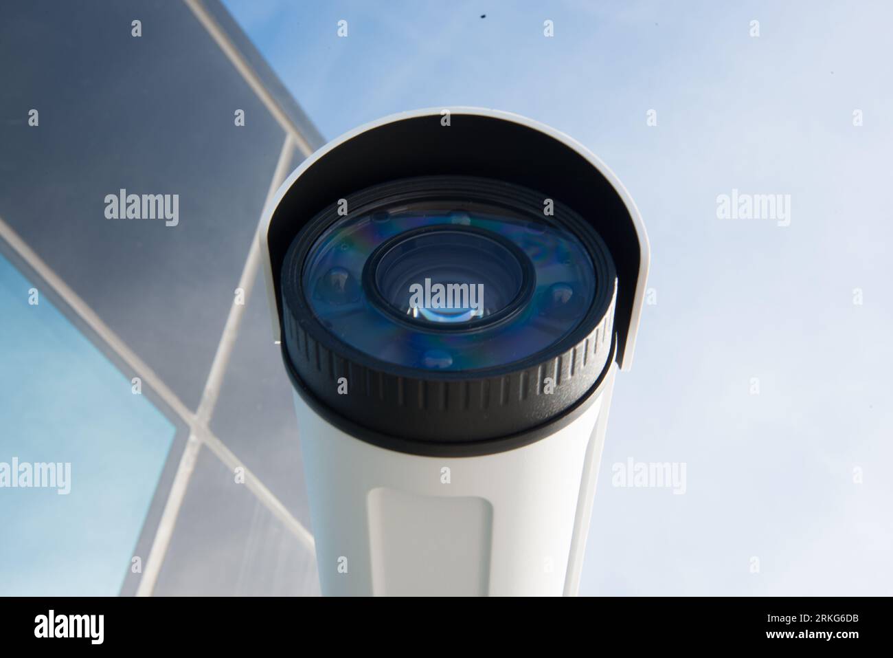 A view from below a security camera, capturing the clear lens Stock ...