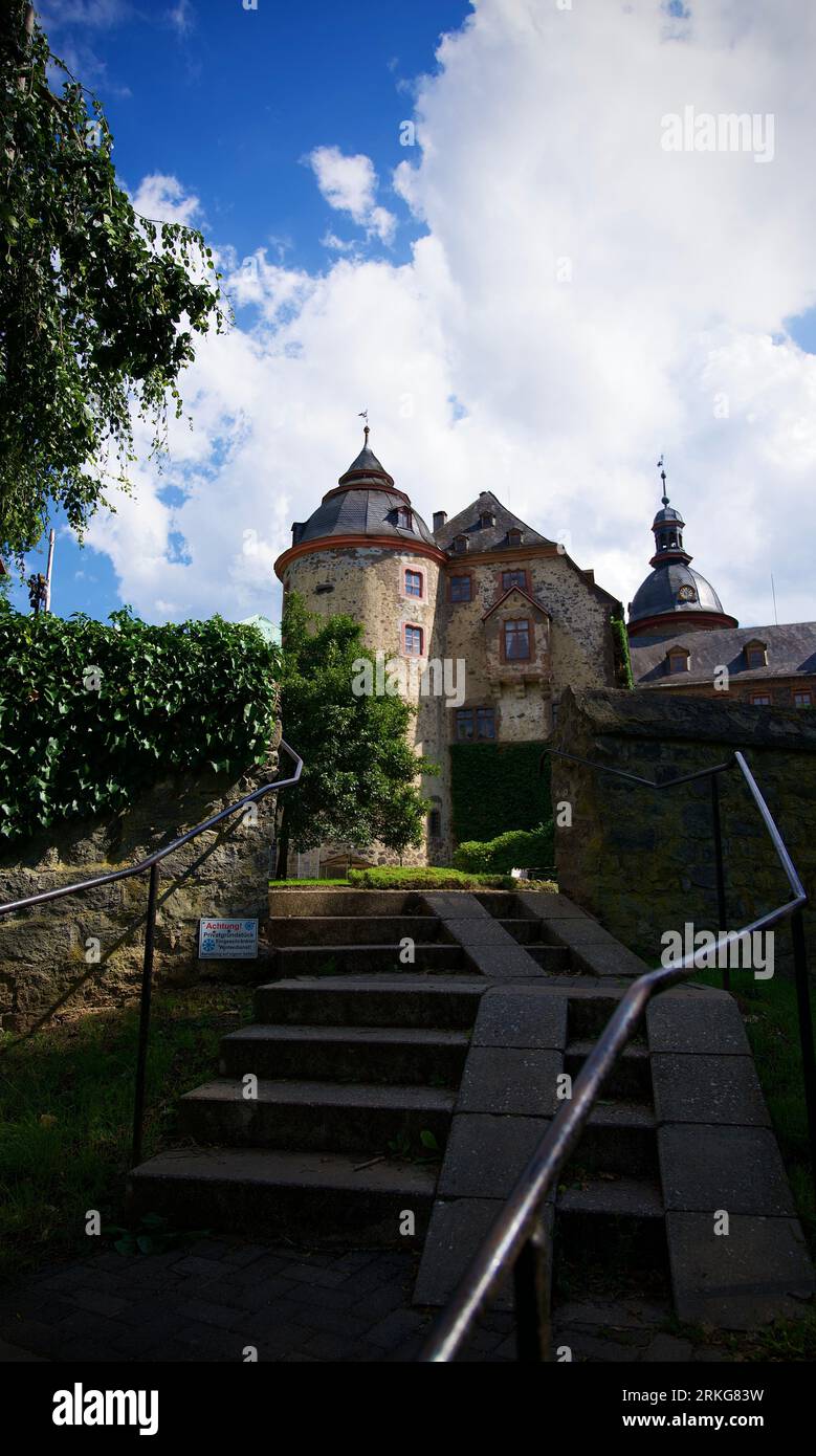A scenic view of Schloss Laubach historic castle surrounded by lush ...