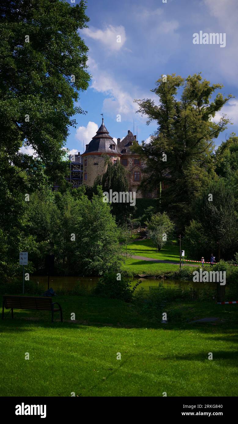A scenic view of Schloss Laubach historic castle surrounded by lush ...