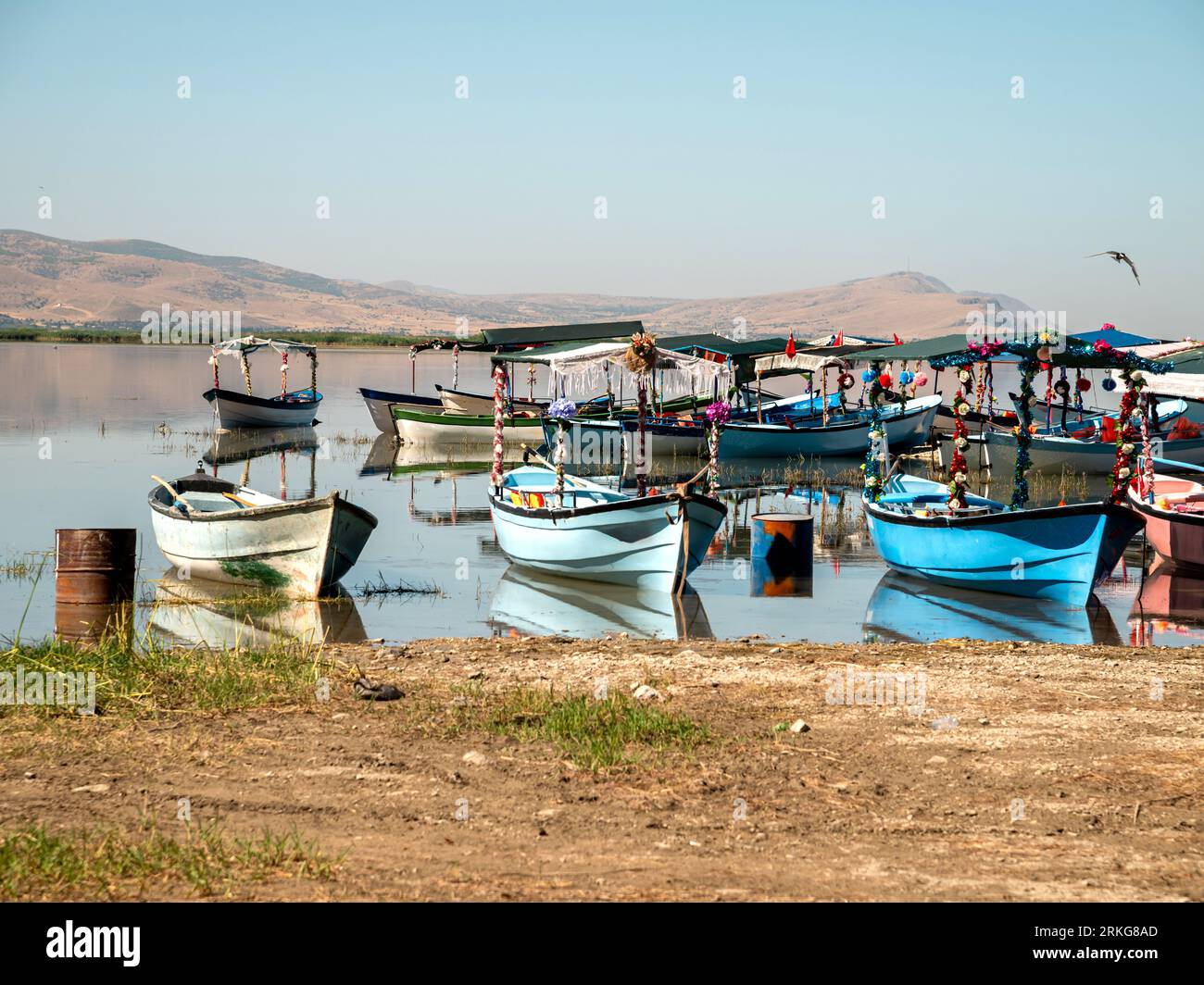 Decorated excursion boats in Isikli lake in Civril, Denizli Stock Photo ...