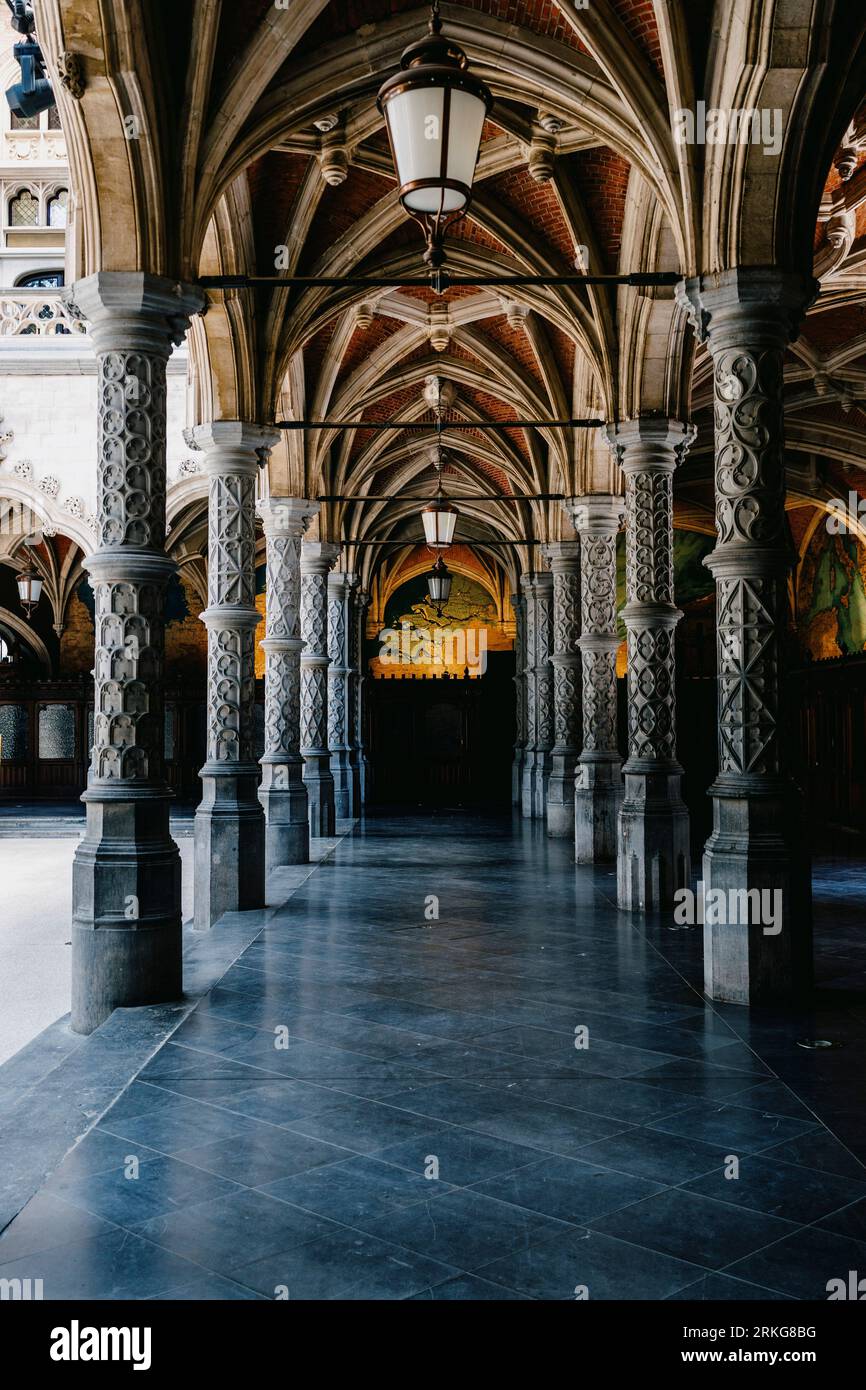 A vertical of an arcade corridor with columns in Belgium Stock Photo ...