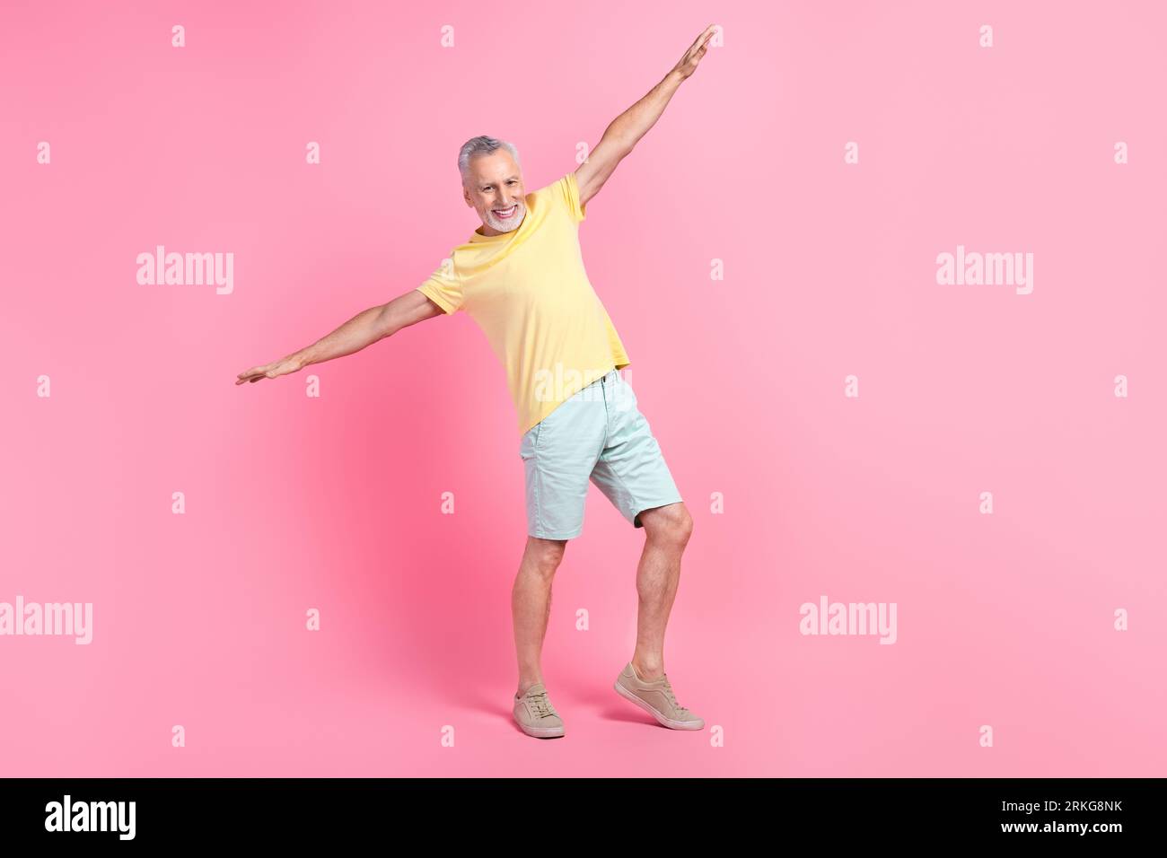 Full body size photo of carefree old retired man flying arms like wings ...