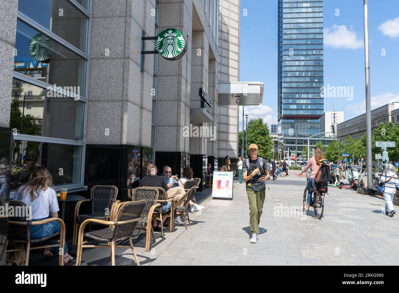 Sign Starbucks Coffee on the Europe street. Entrance in coffee shop ...