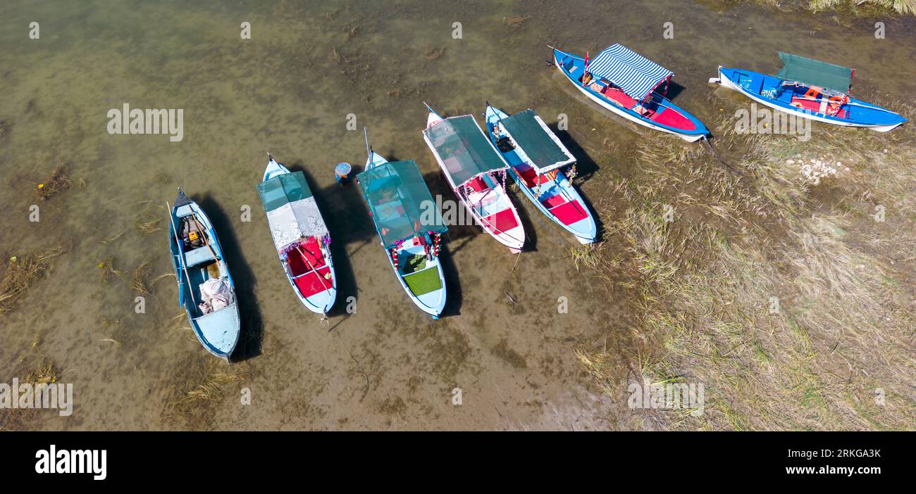Decorated excursion boats in Isikli lake in Civril, Denizli Stock Photo ...